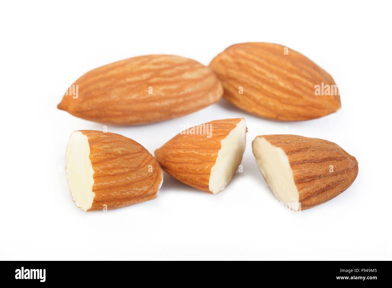 raw almond nuts isolated on white background Stock Photo - Alamy