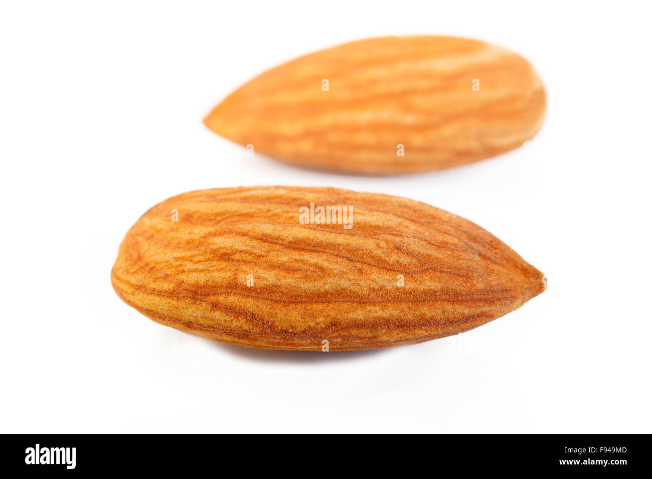 raw almond nuts isolated on white background Stock Photo - Alamy