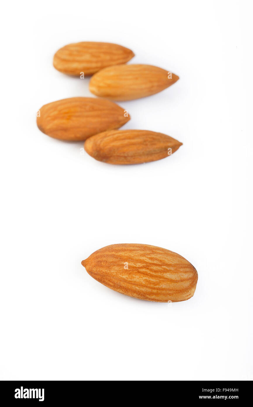 raw almond nuts isolated on white background Stock Photo - Alamy