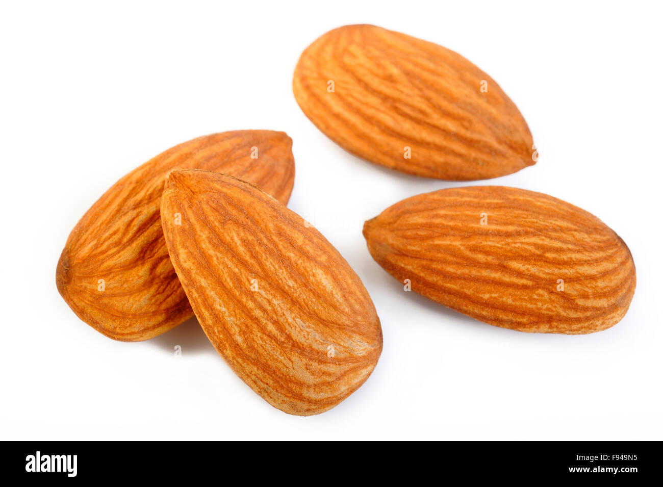 raw almond nuts isolated on white background Stock Photo - Alamy