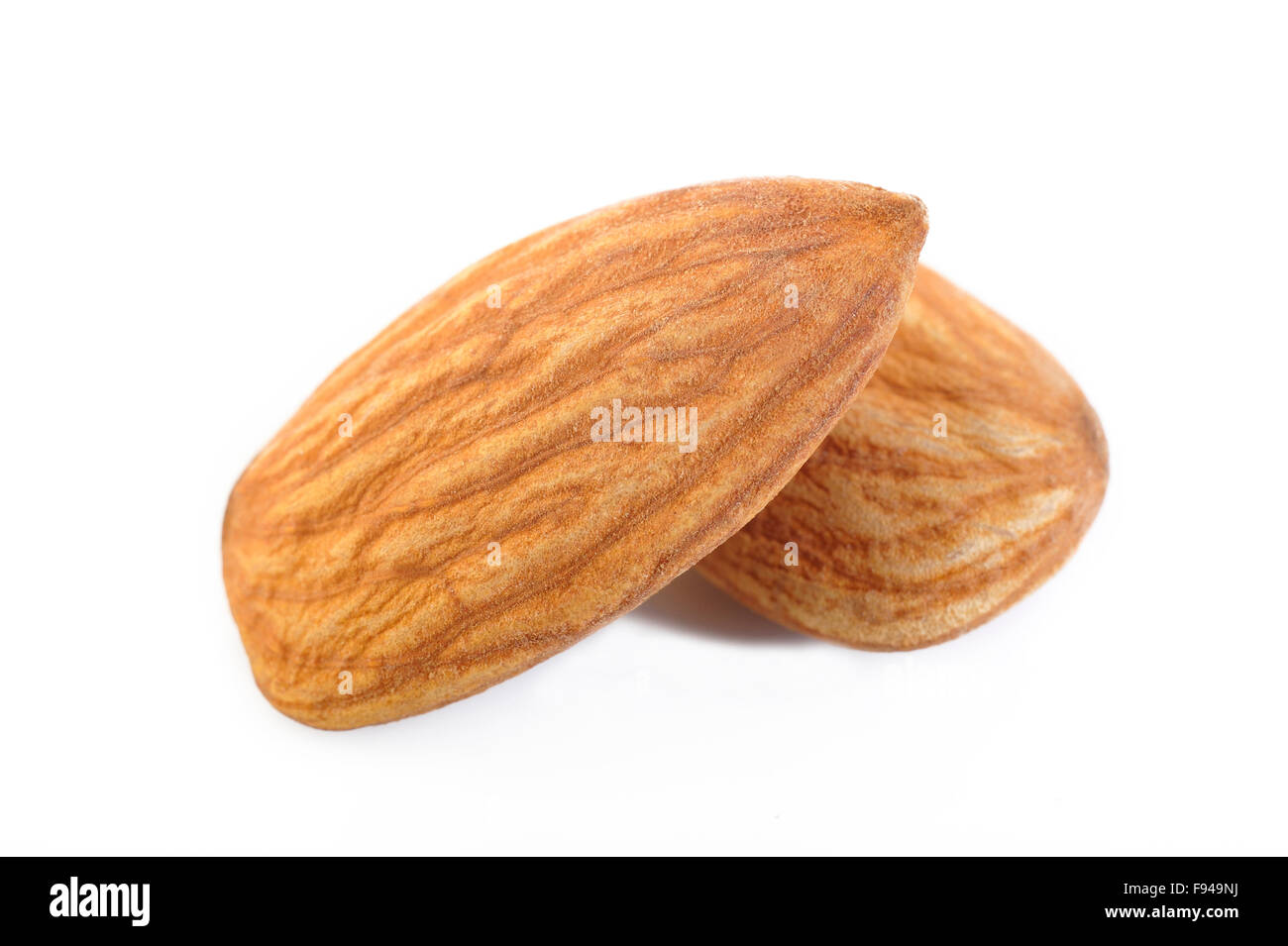 raw almond nuts isolated on white background Stock Photo - Alamy