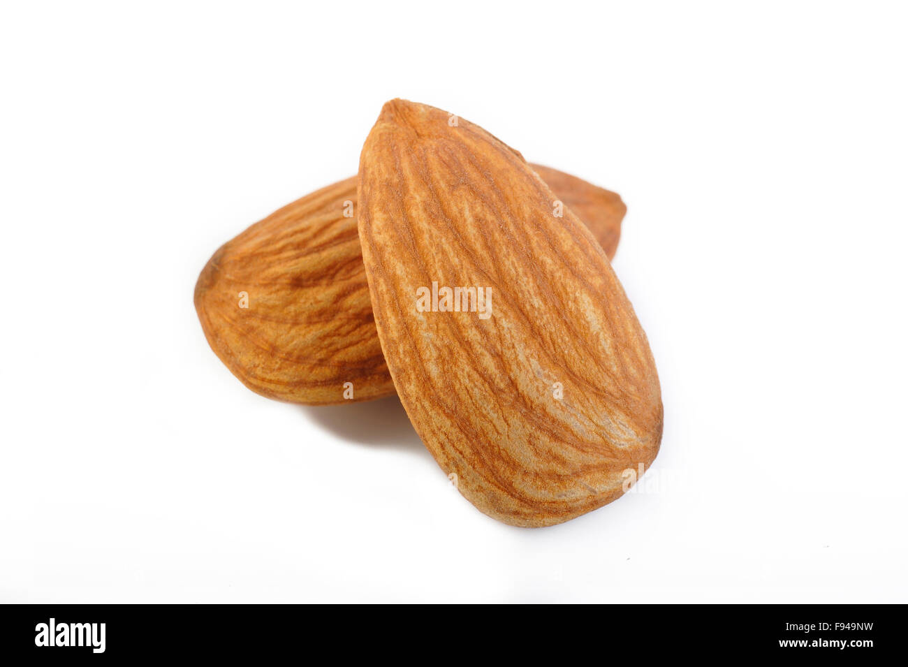 raw almond nuts isolated on white background Stock Photo - Alamy