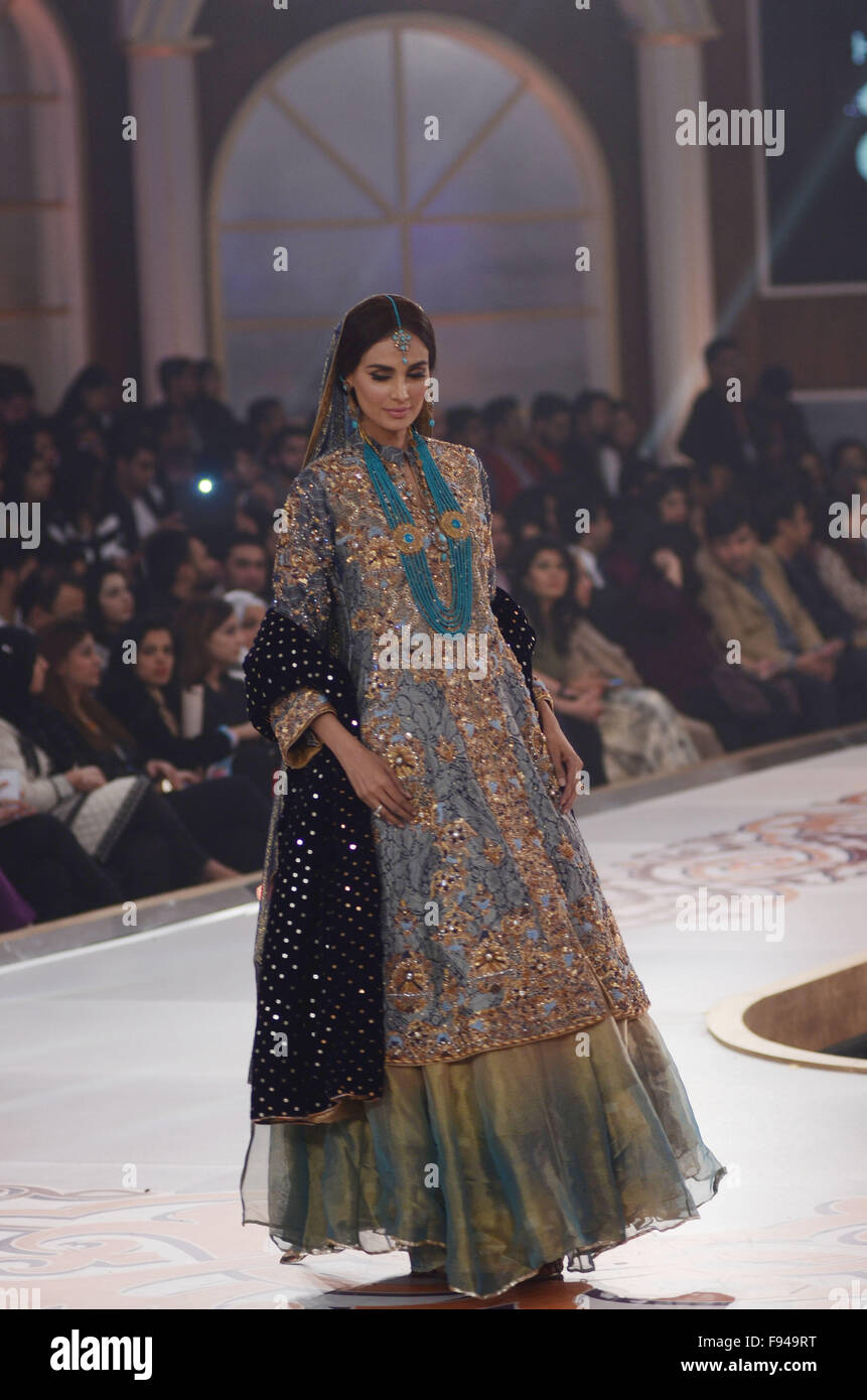 Lahore, Pakistan. 13th Dec, 2015. Pakistani model presents the creation ...