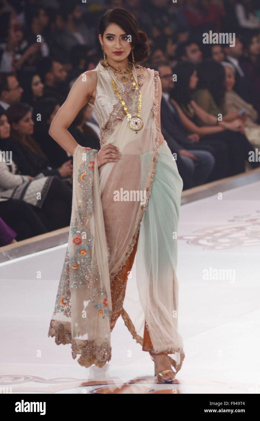Lahore, Pakistan. 13th Dec, 2015. Pakistani model presents the creation ...