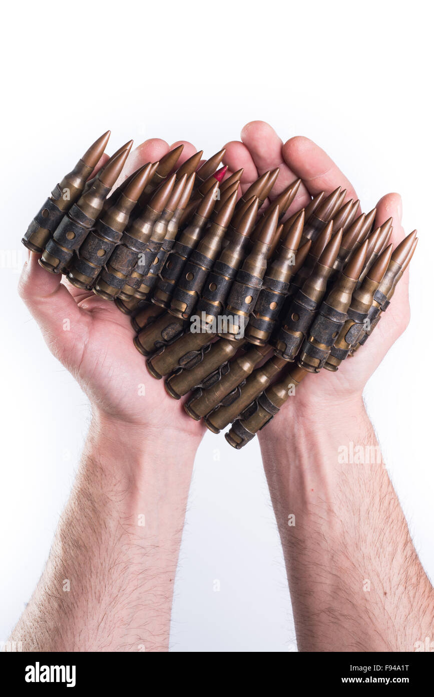 Concept hands giving bullets on white background Stock Photo - Alamy