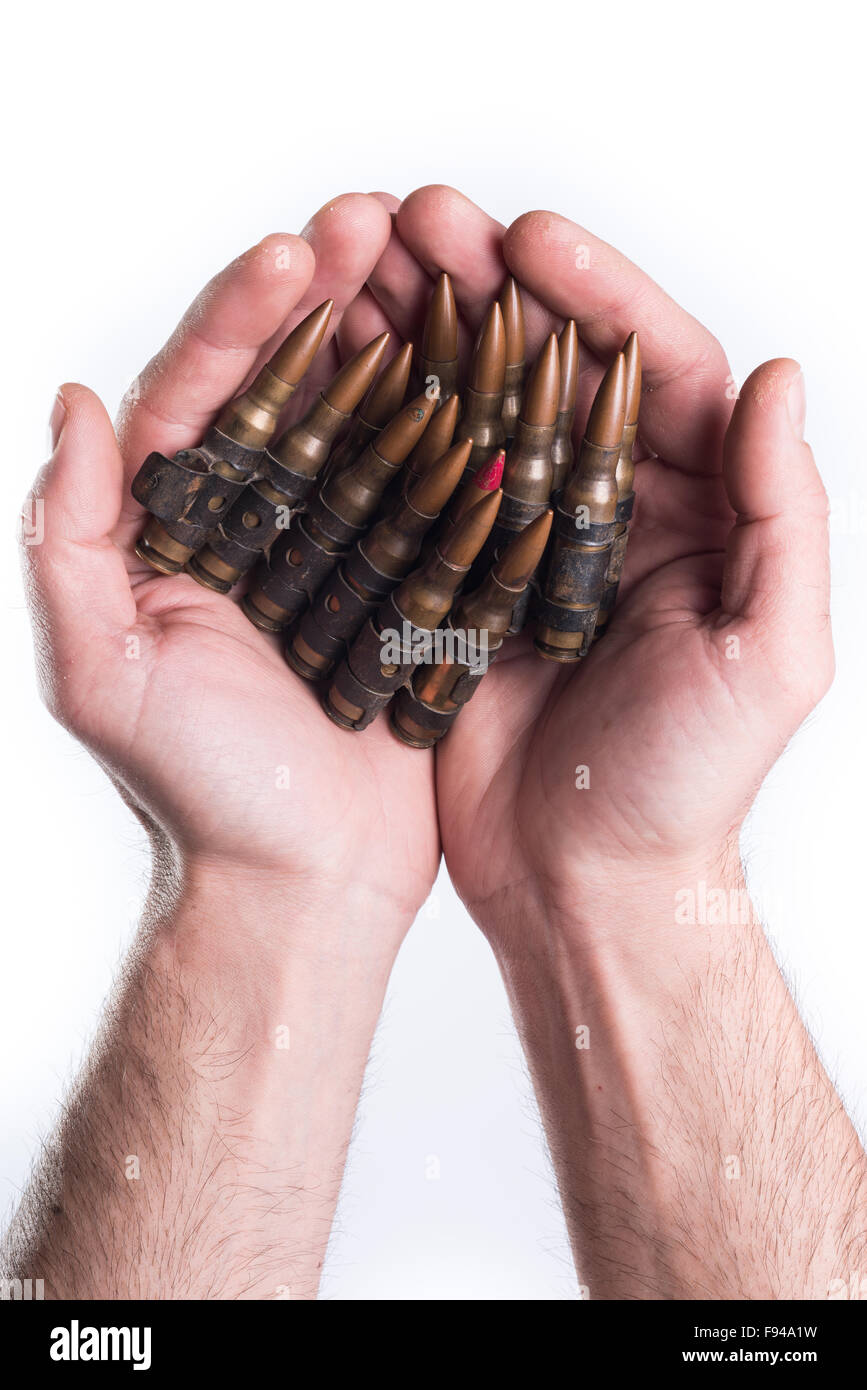 Concept hands giving bullets on white background Stock Photo - Alamy