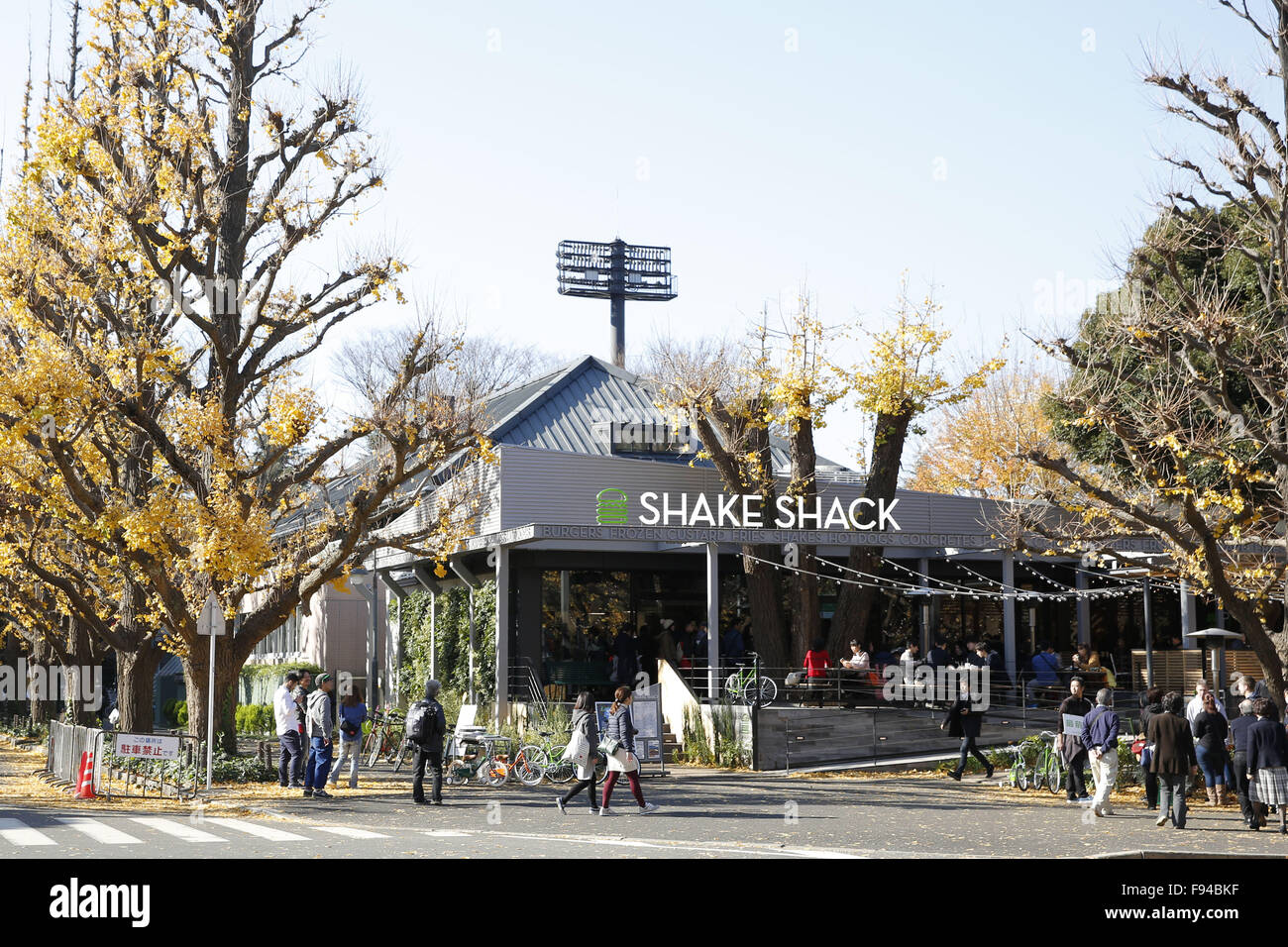 People line up outside the burger restaurant Shake Shack in Meiji-Jingu ...