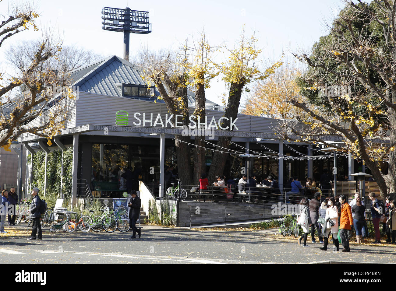 People line up outside the burger restaurant Shake Shack in Meiji-Jingu ...