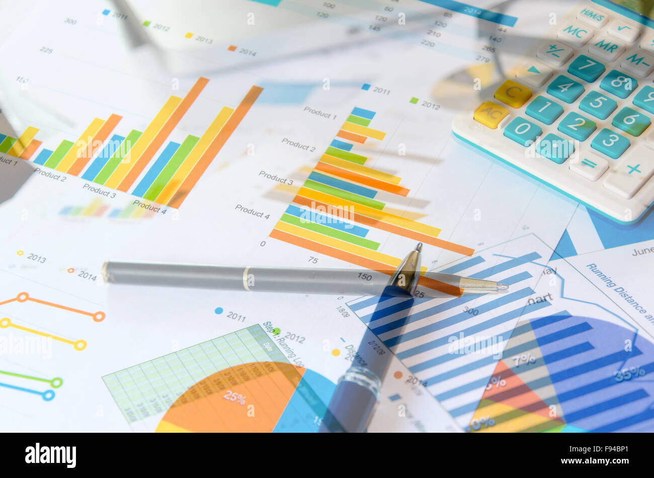 Financial paper charts and graphs on the table Stock Photo - Alamy
