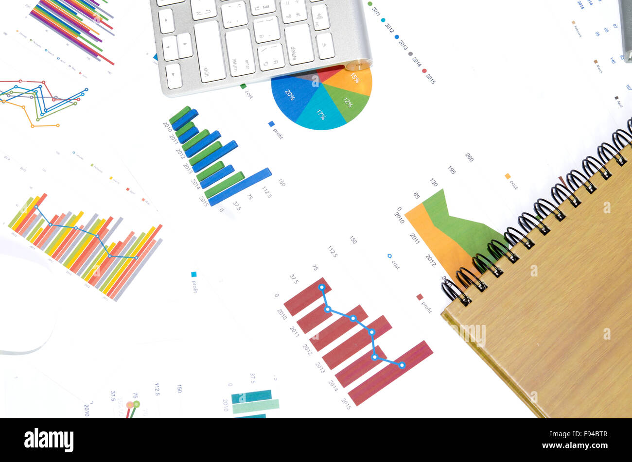 Financial paper charts and graphs on the table Stock Photo - Alamy