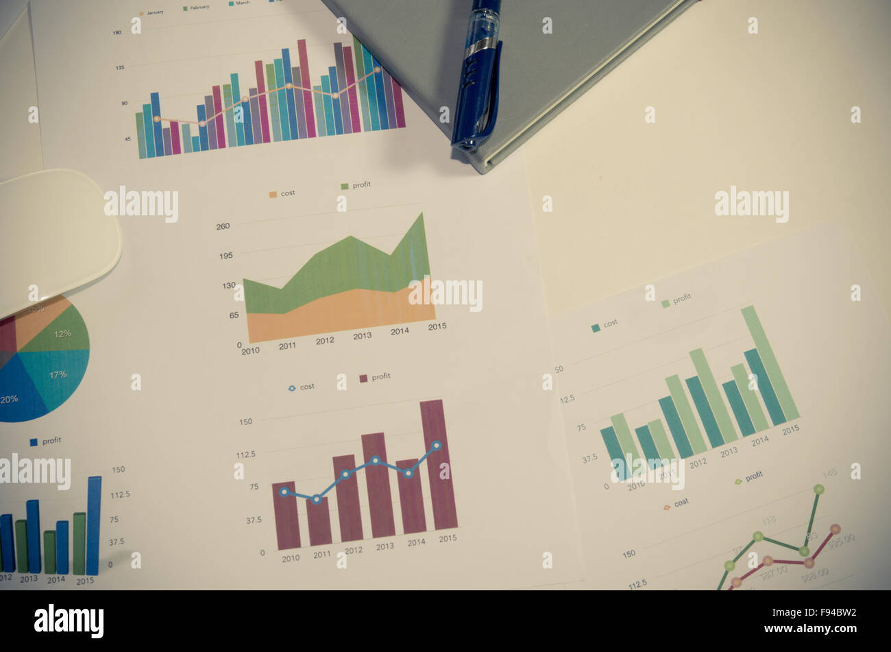 Financial paper charts and graphs on the table Stock Photo - Alamy