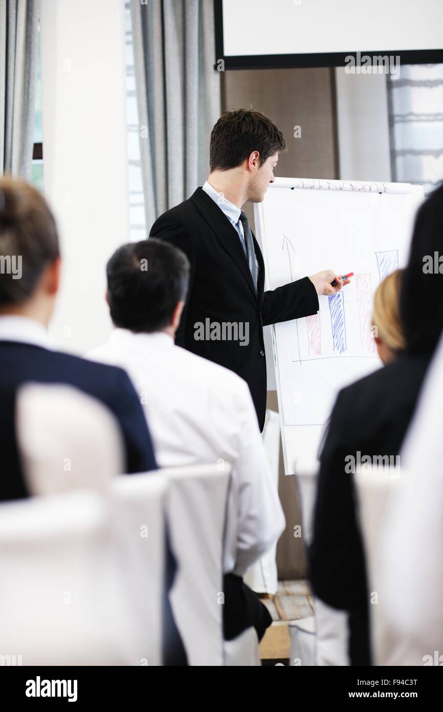 young male business man giving a presentation at a meeting seminar at ...