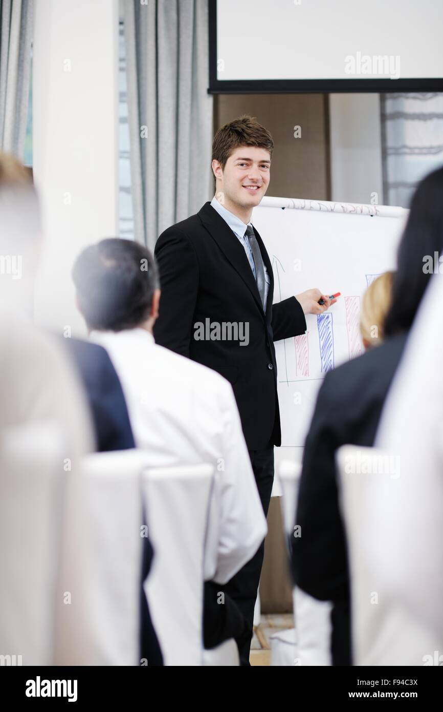 young male business man giving a presentation at a meeting seminar at ...