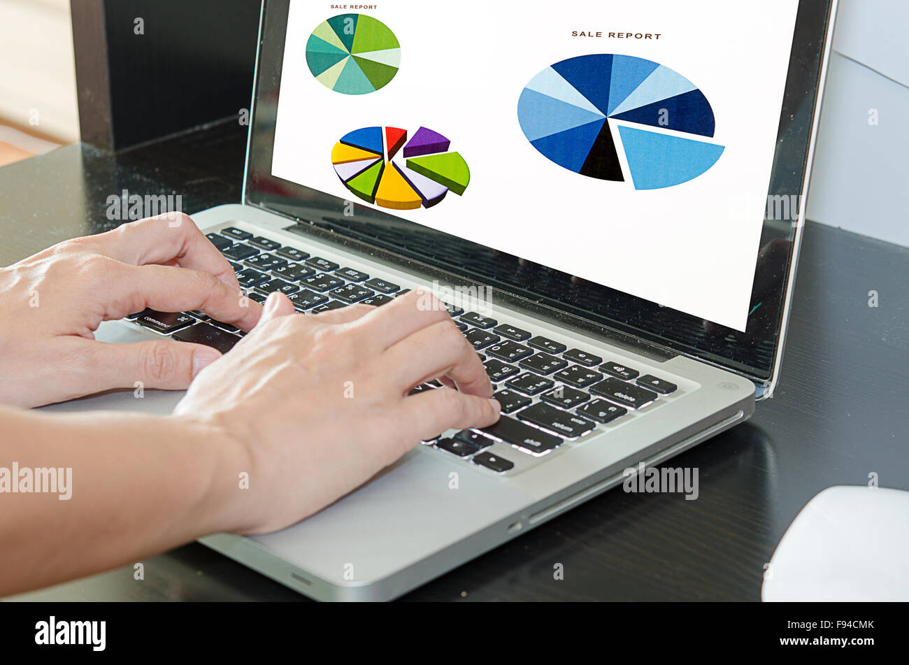 Laptop on table showing charts and graph, Analysis Business Accounting ...