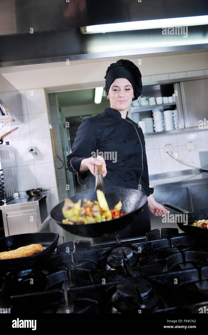 beautiful young chef woman prepare and decorating tasty food in kitchen ...