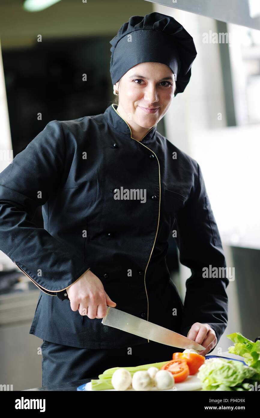 beautiful young chef woman prepare and decorating tasty food in kitchen ...