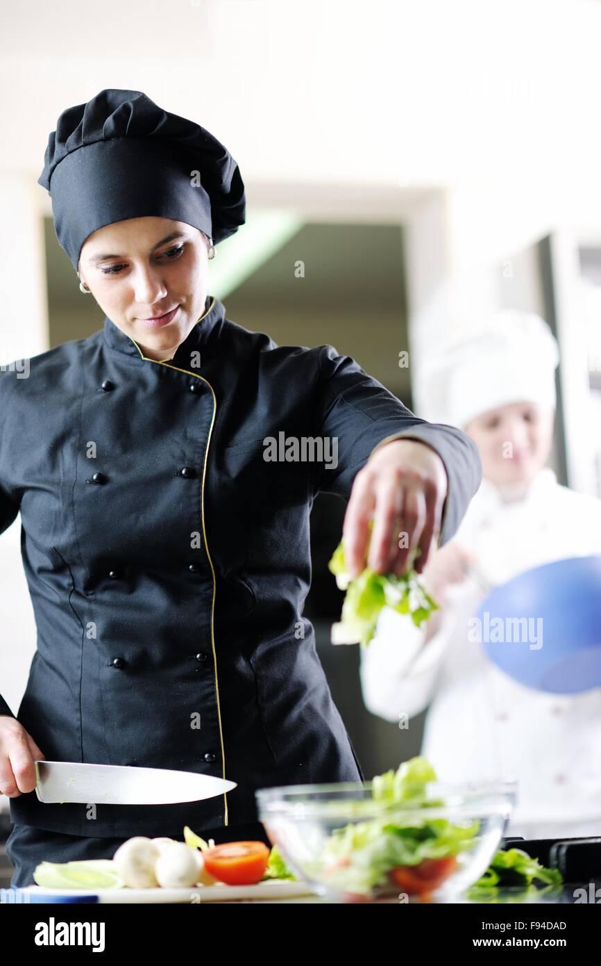 beautiful young chef woman prepare and decorating tasty food in kitchen ...