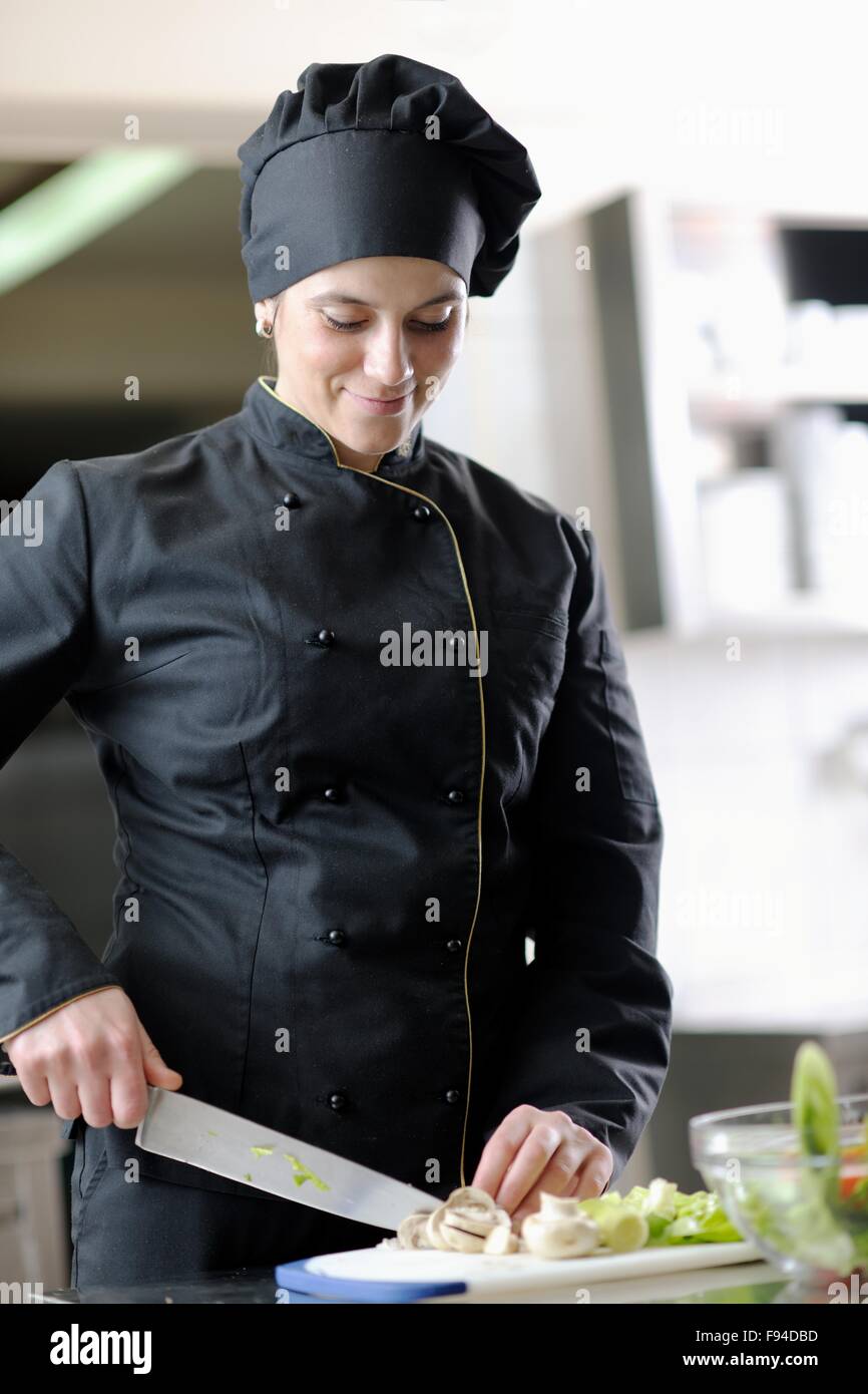 beautiful young chef woman prepare and decorating tasty food in kitchen ...