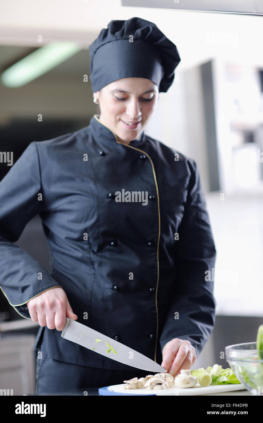 beautiful young chef woman prepare and decorating tasty food in kitchen ...