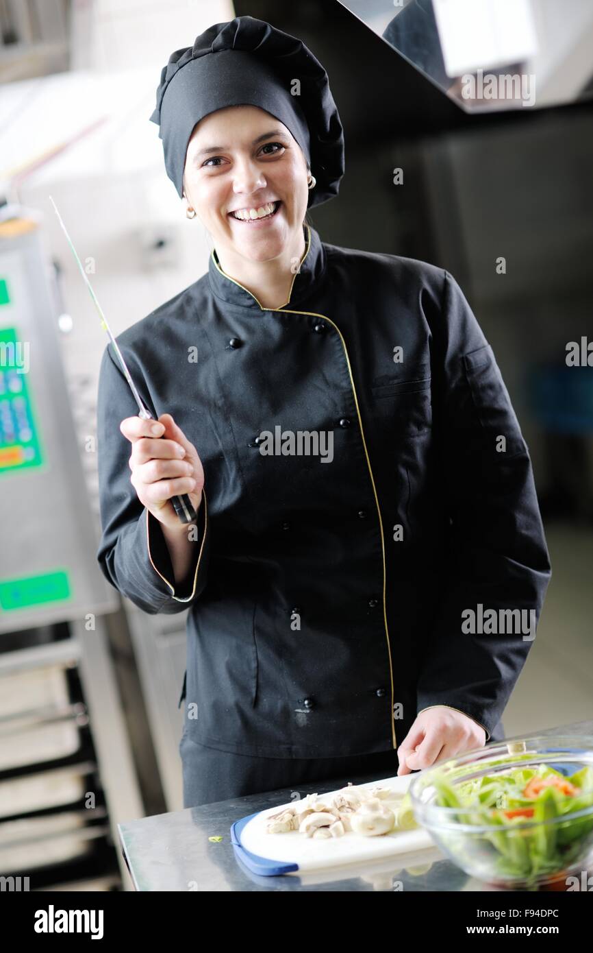 beautiful young chef woman prepare and decorating tasty food in kitchen ...