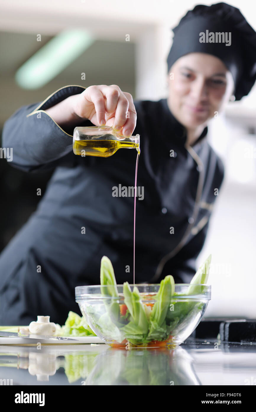 beautiful young chef woman prepare and decorating tasty food in kitchen ...