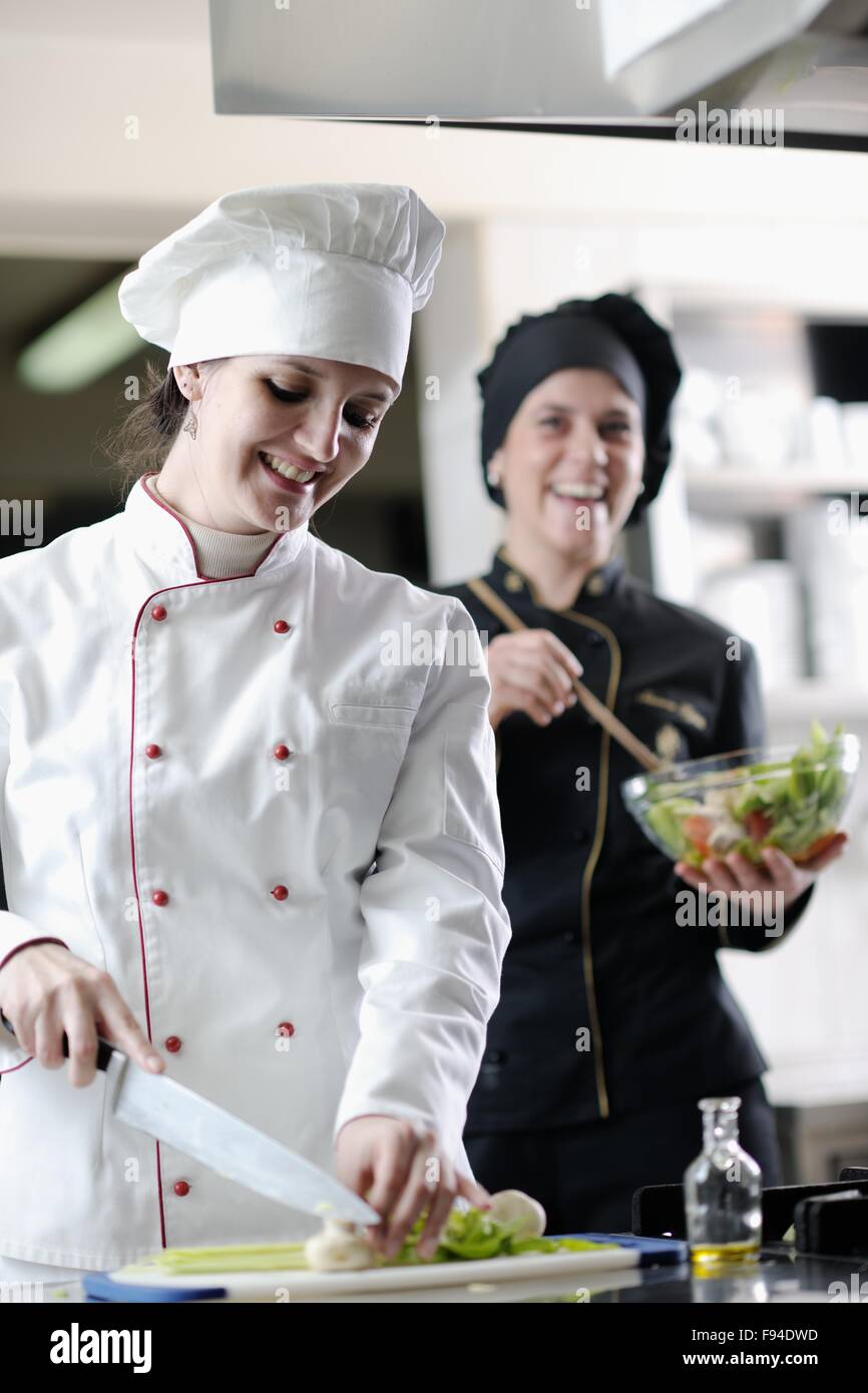 beautiful young chef woman prepare and decorating tasty food in kitchen ...