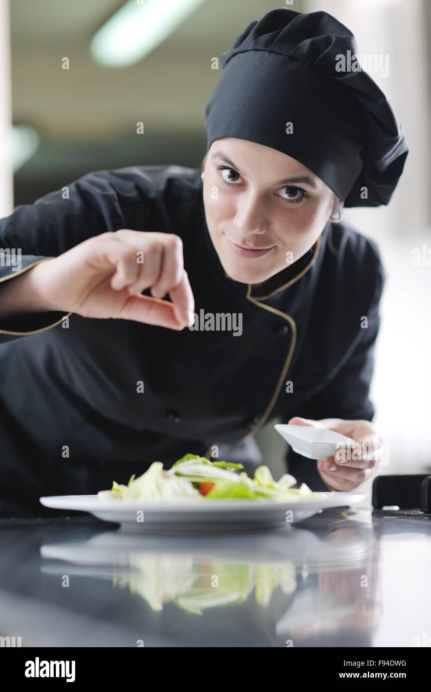 beautiful young chef woman prepare and decorating tasty food in kitchen ...