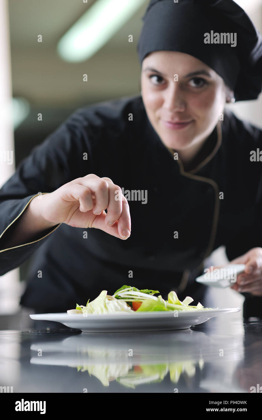 beautiful young chef woman prepare and decorating tasty food in kitchen ...