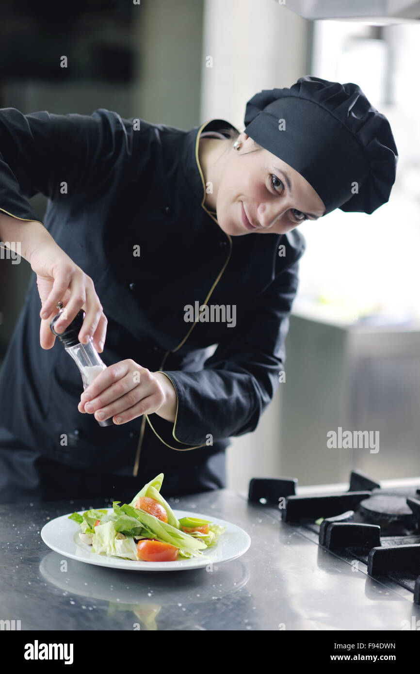 beautiful young chef woman prepare and decorating tasty food in kitchen ...