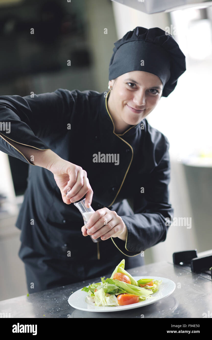 beautiful young chef woman prepare and decorating tasty food in kitchen ...