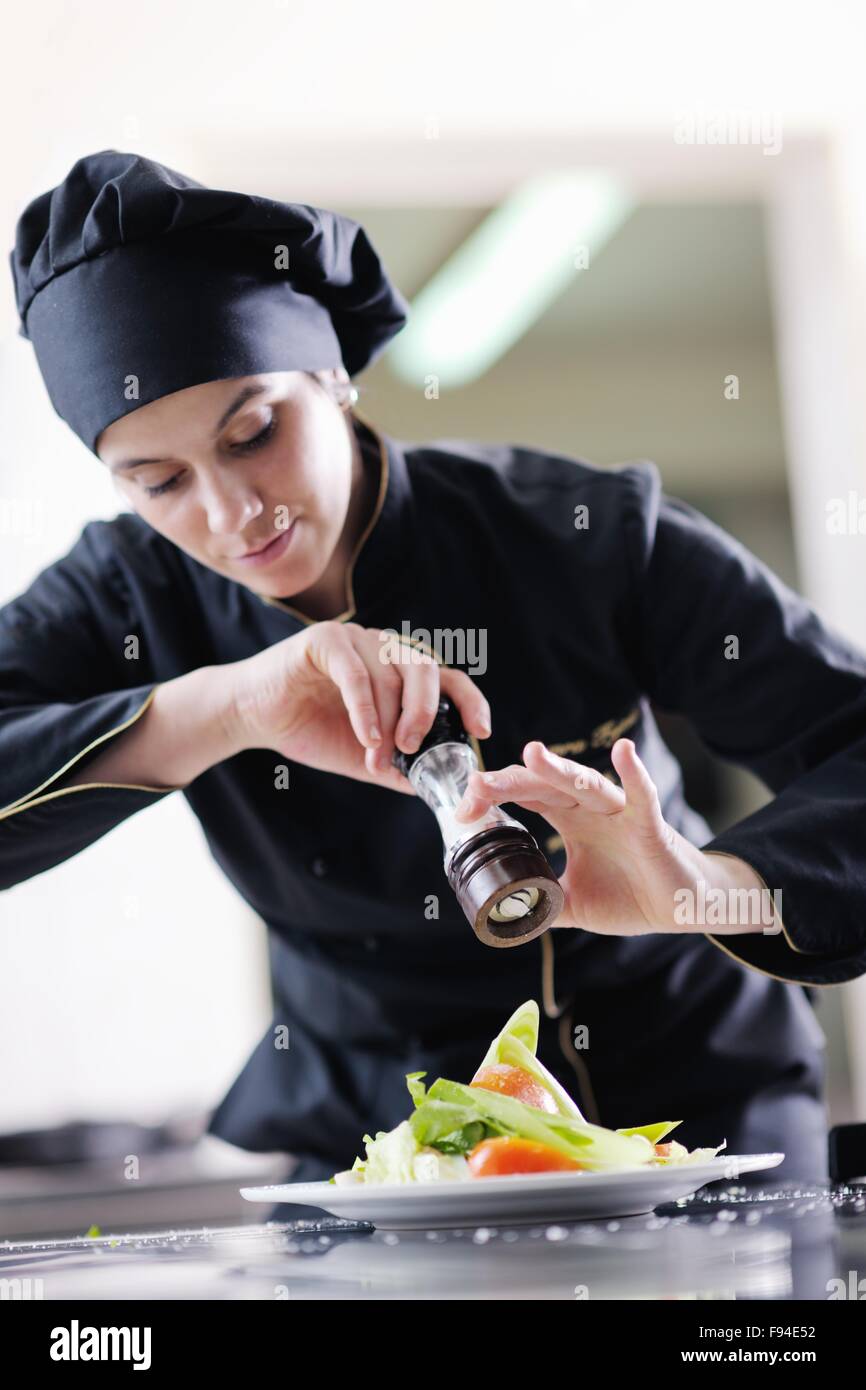 beautiful young chef woman prepare and decorating tasty food in kitchen ...
