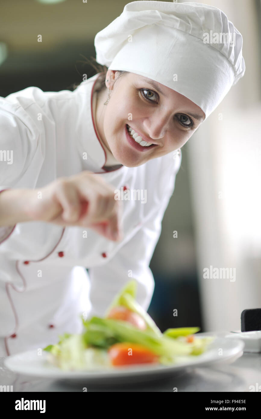 beautiful young chef woman prepare and decorating tasty food in kitchen ...