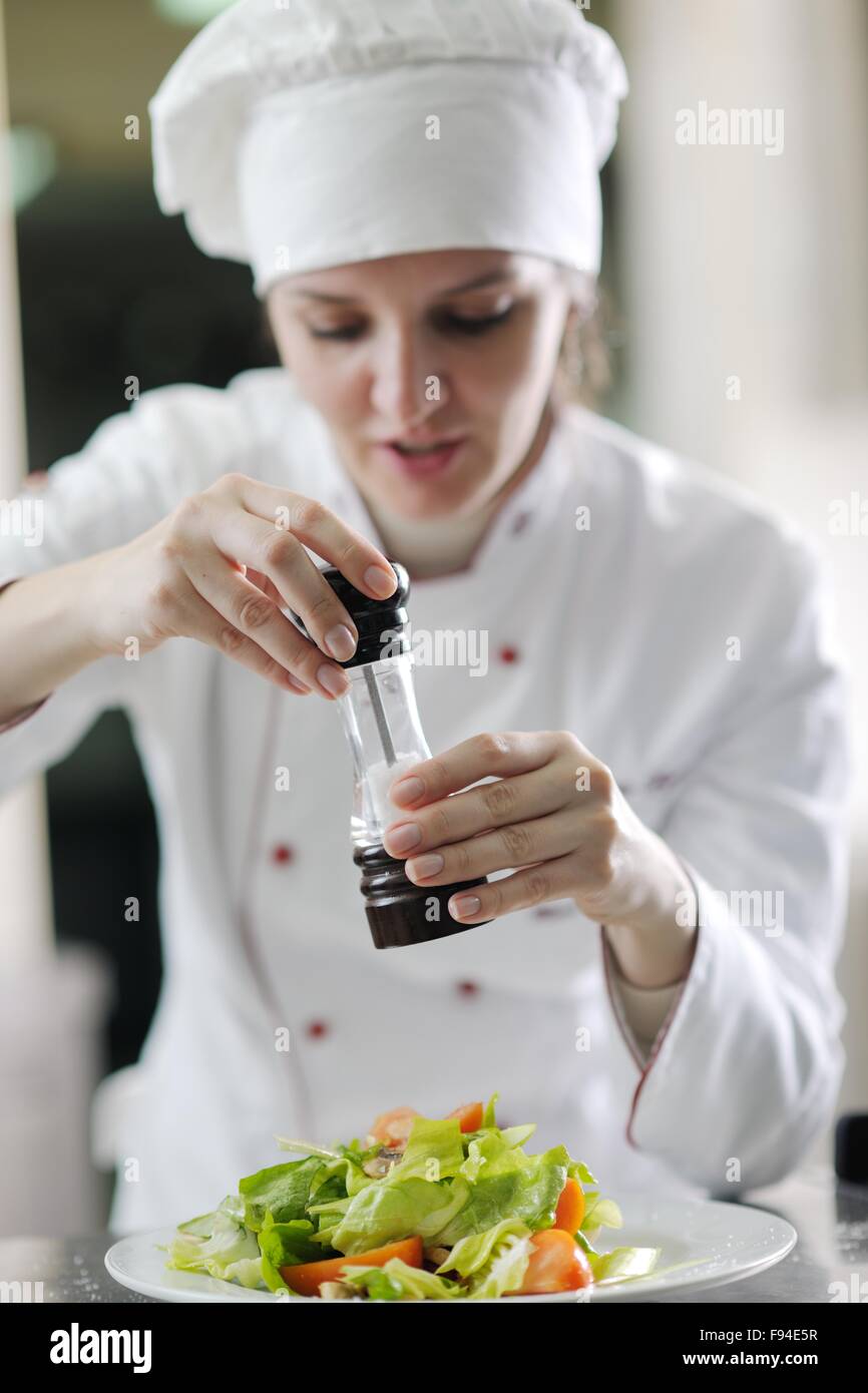 beautiful young chef woman prepare and decorating tasty food in kitchen ...