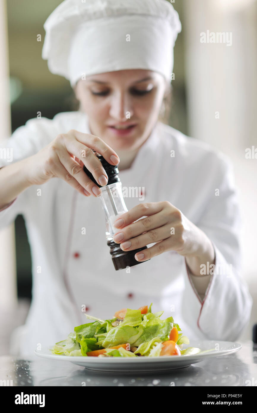beautiful young chef woman prepare and decorating tasty food in kitchen ...