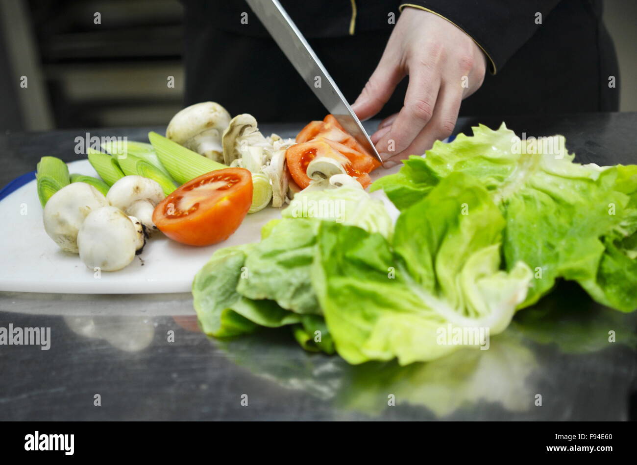 beautiful young chef woman prepare and decorating tasty food in kitchen ...