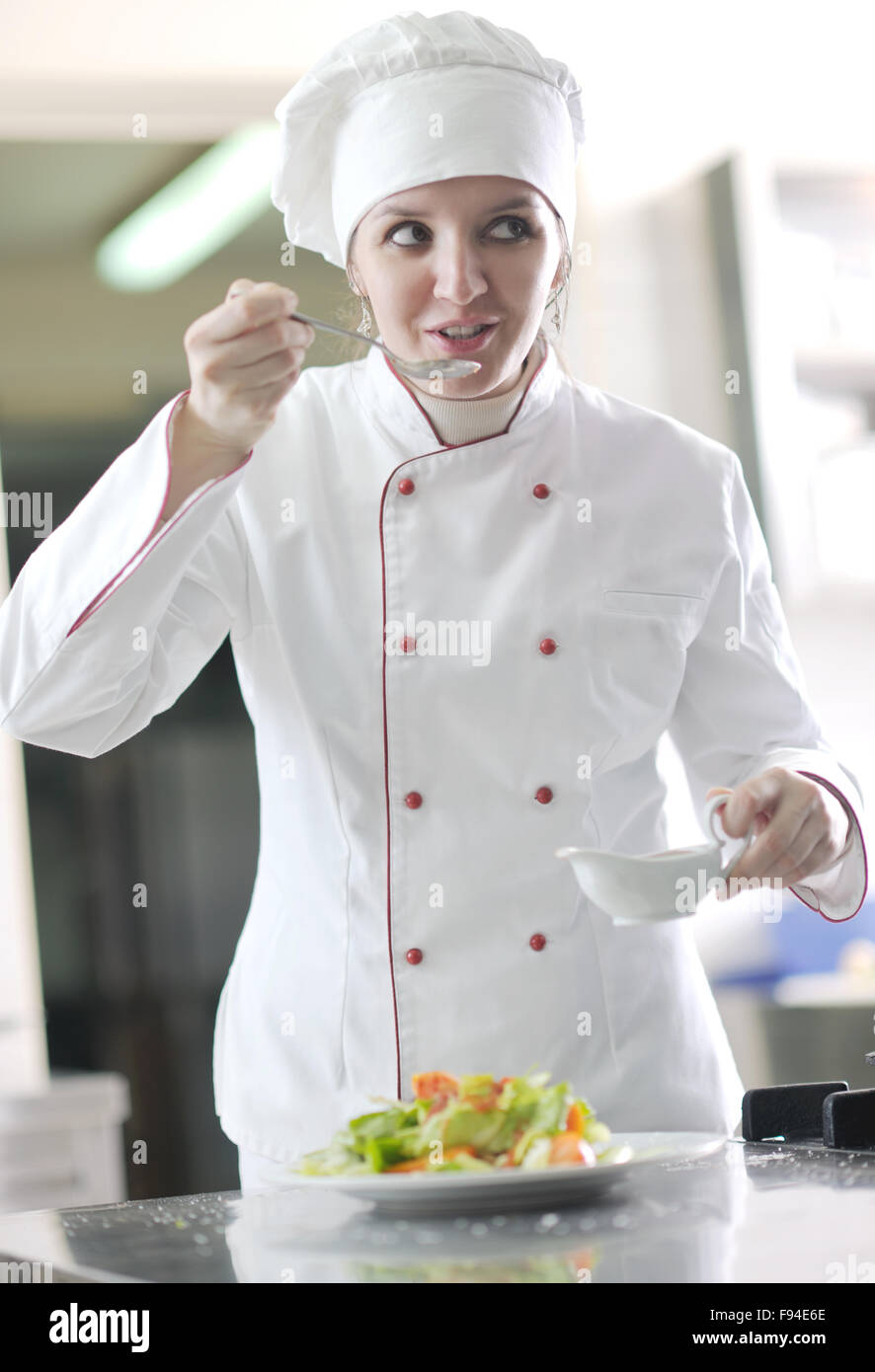 beautiful young chef woman prepare and decorating tasty food in kitchen ...