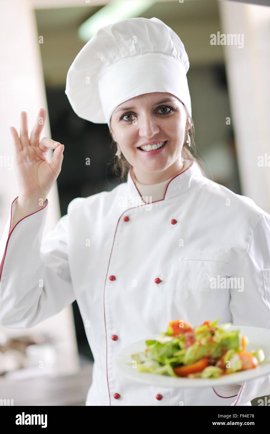 beautiful young chef woman prepare and decorating tasty food in kitchen ...