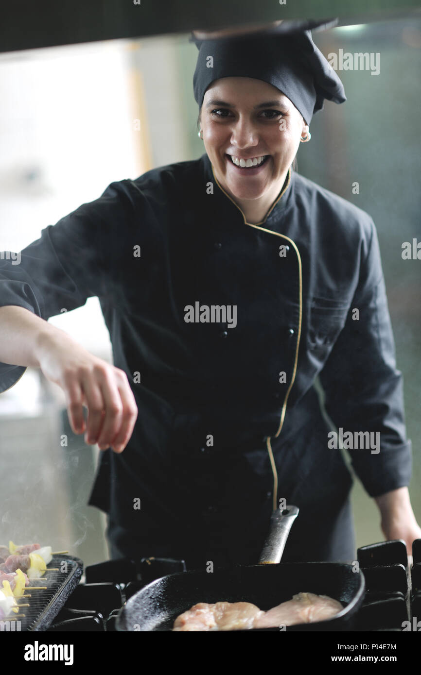 beautiful young chef woman prepare and decorating tasty food in kitchen ...