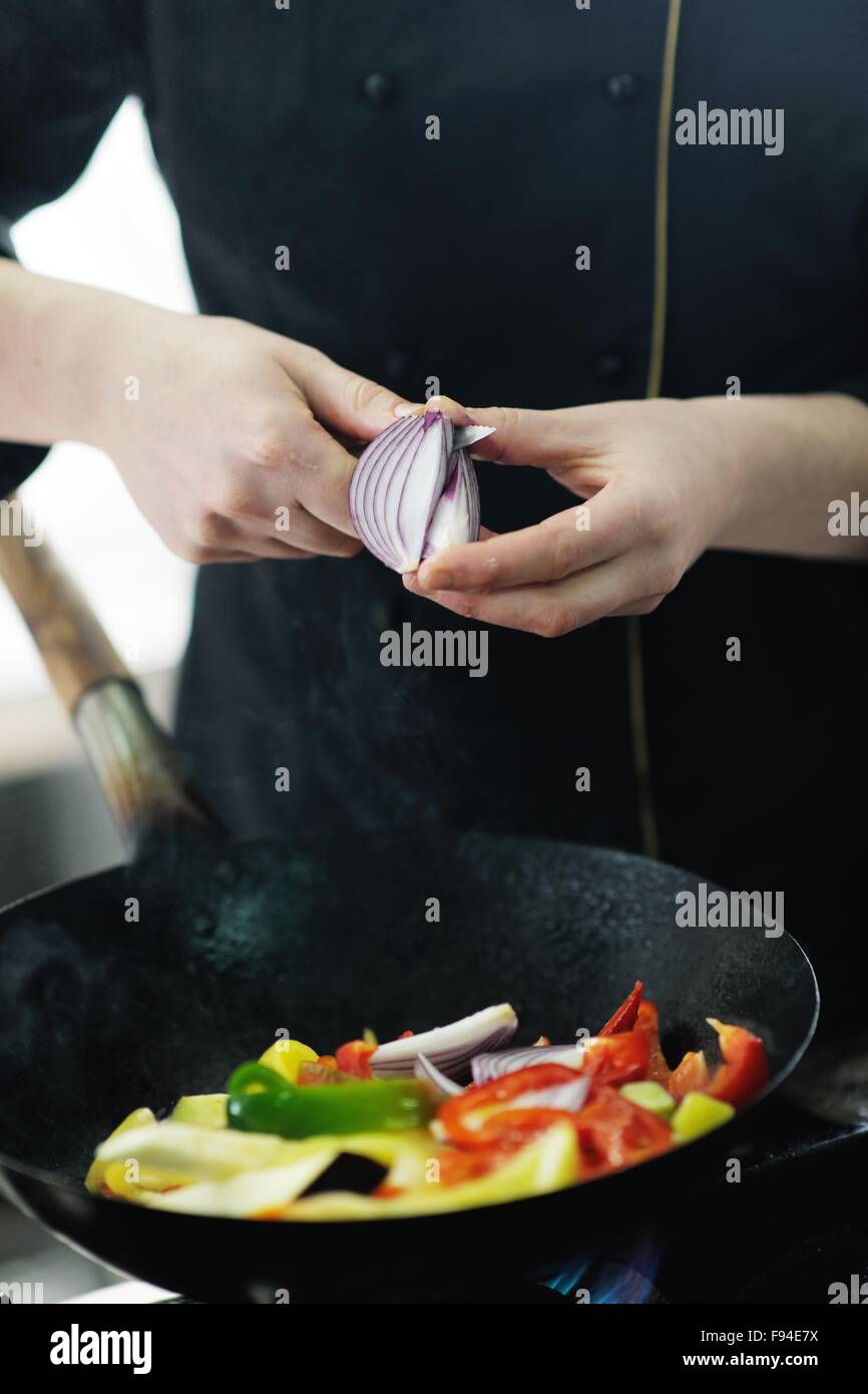 beautiful young chef woman prepare and decorating tasty food in kitchen ...