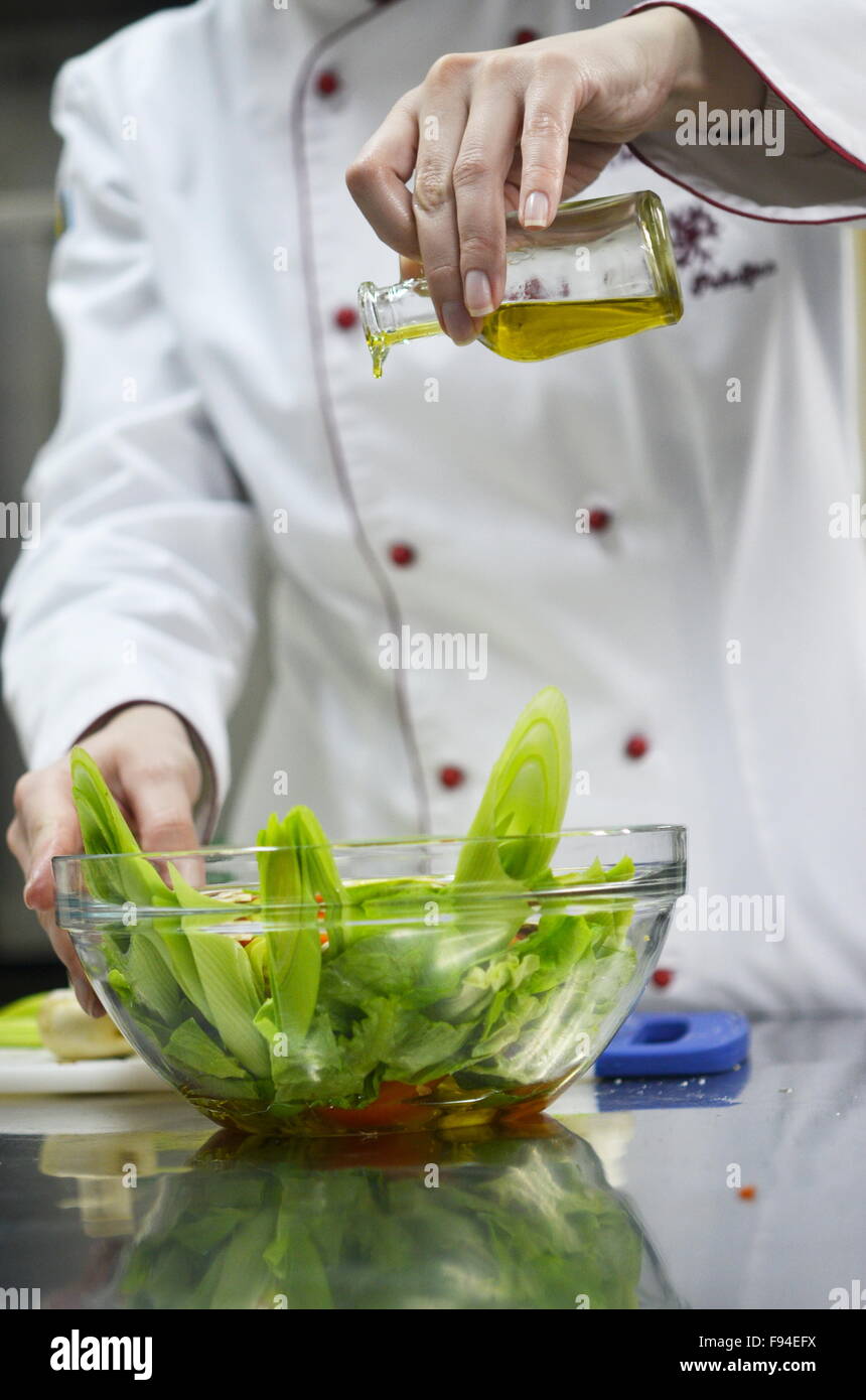 beautiful young chef woman prepare and decorating tasty food in kitchen ...