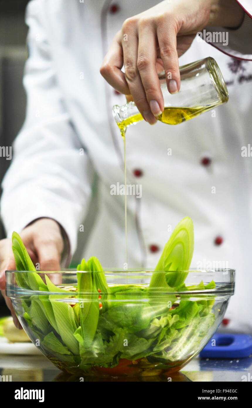beautiful young chef woman prepare and decorating tasty food in kitchen ...