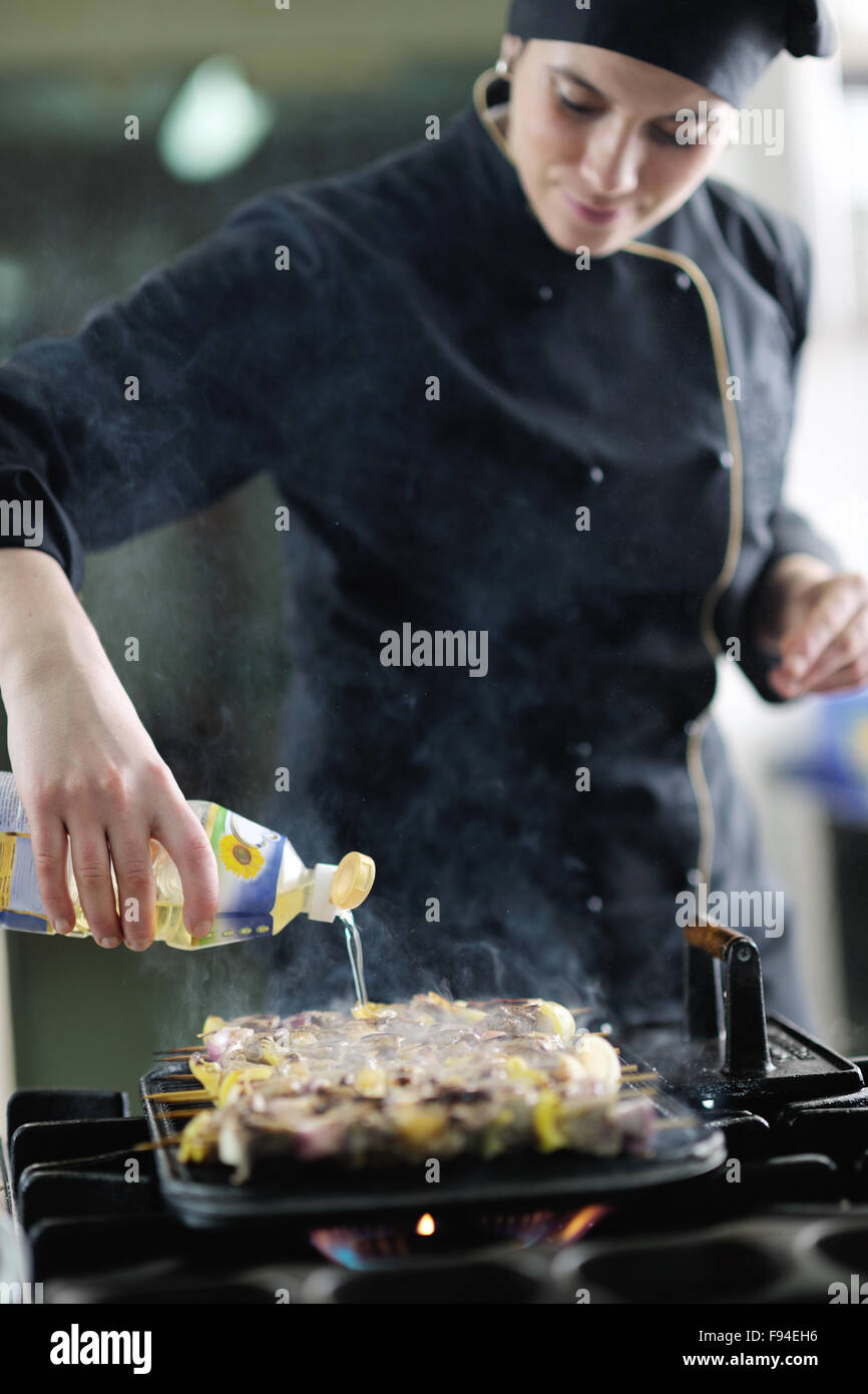 beautiful young chef woman prepare and decorating tasty food in kitchen ...