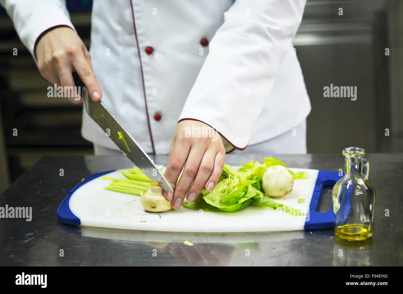beautiful young chef woman prepare and decorating tasty food in kitchen ...