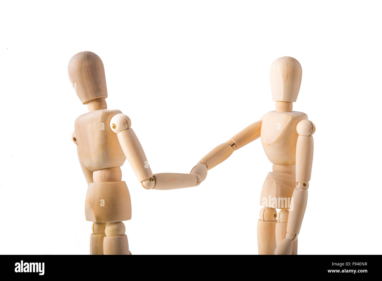 Two puppets shaking hands on white background Stock Photo - Alamy