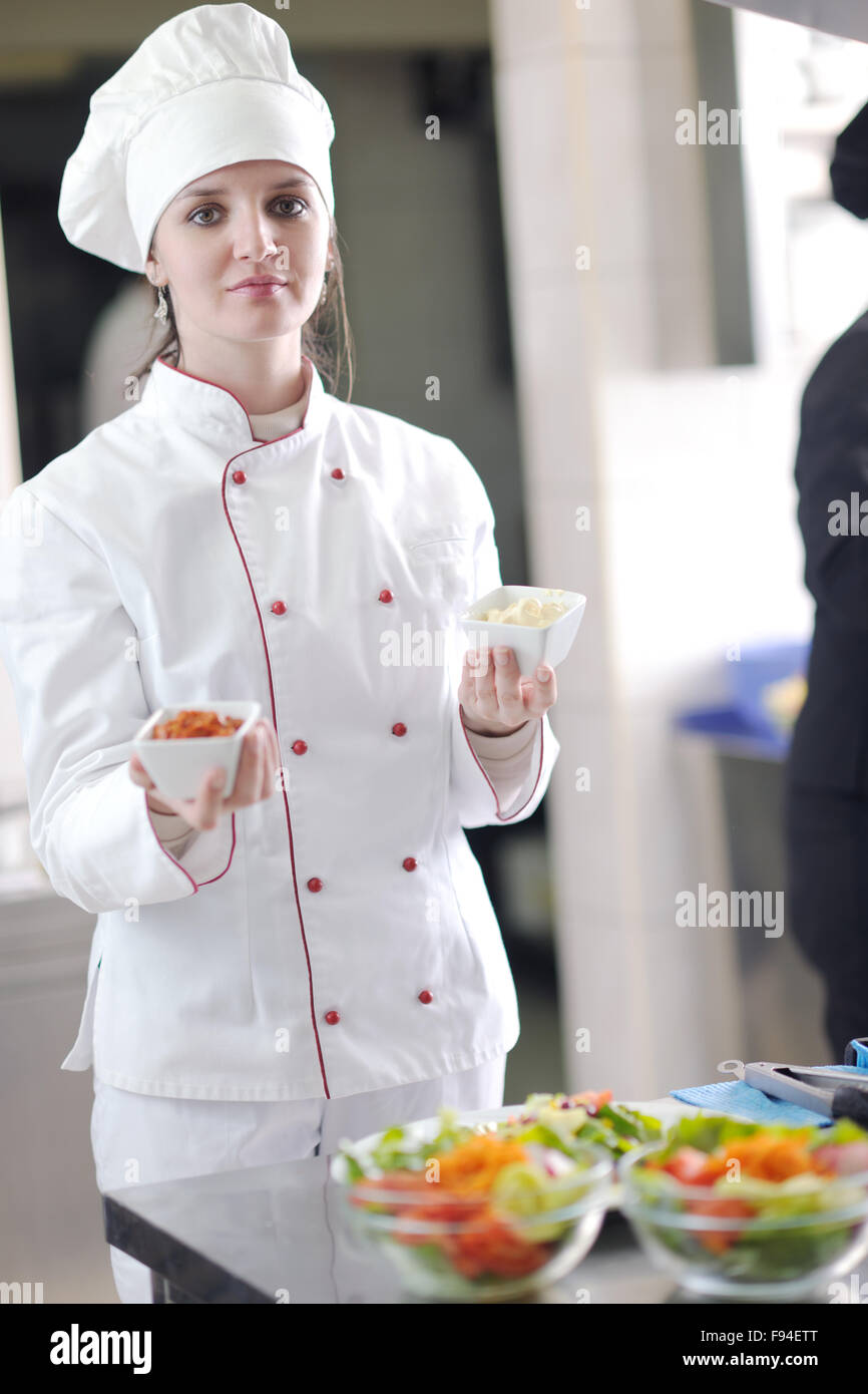 beautiful young chef woman prepare and decorating tasty food in kitchen ...