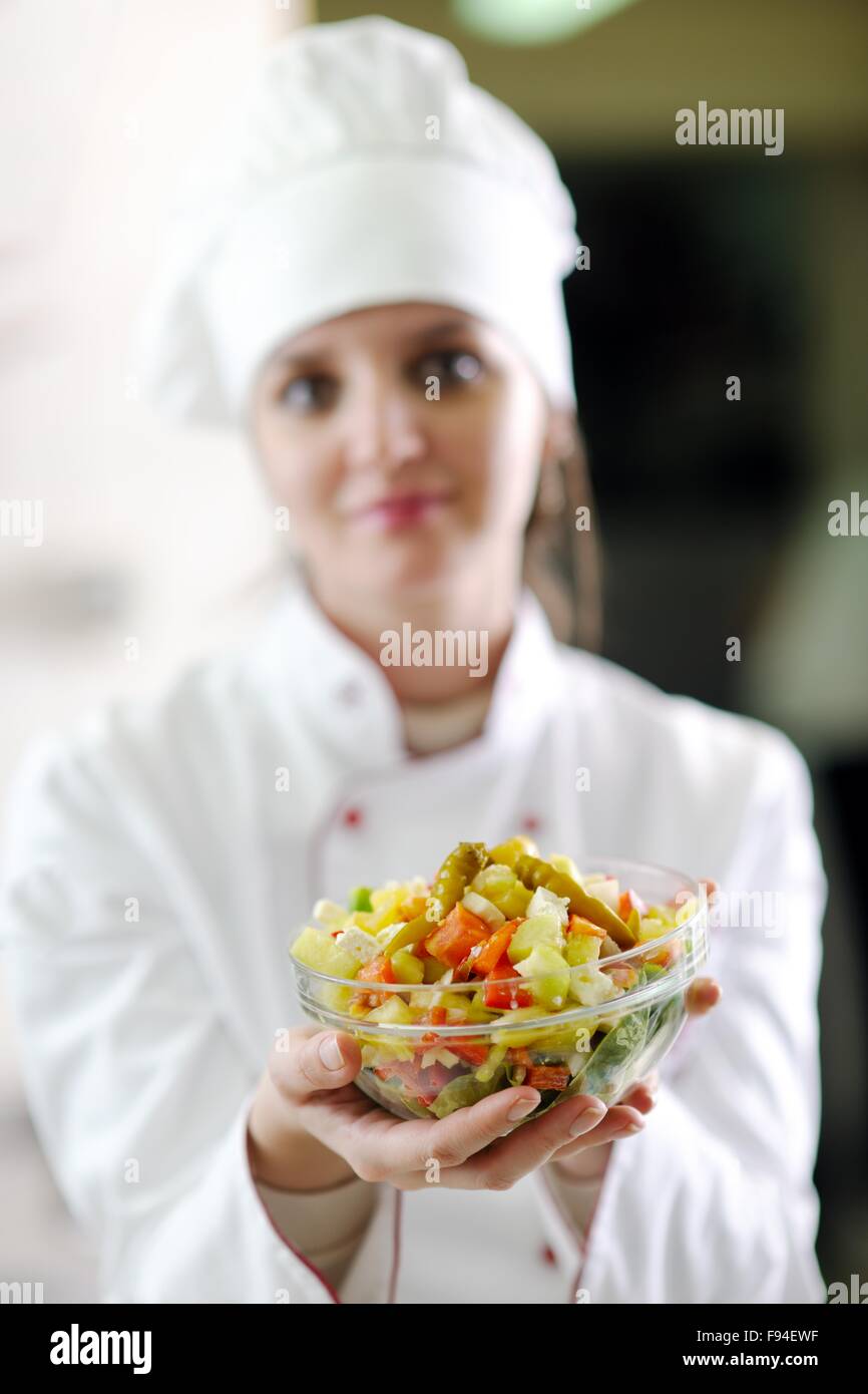 beautiful young chef woman prepare and decorating tasty food in kitchen ...