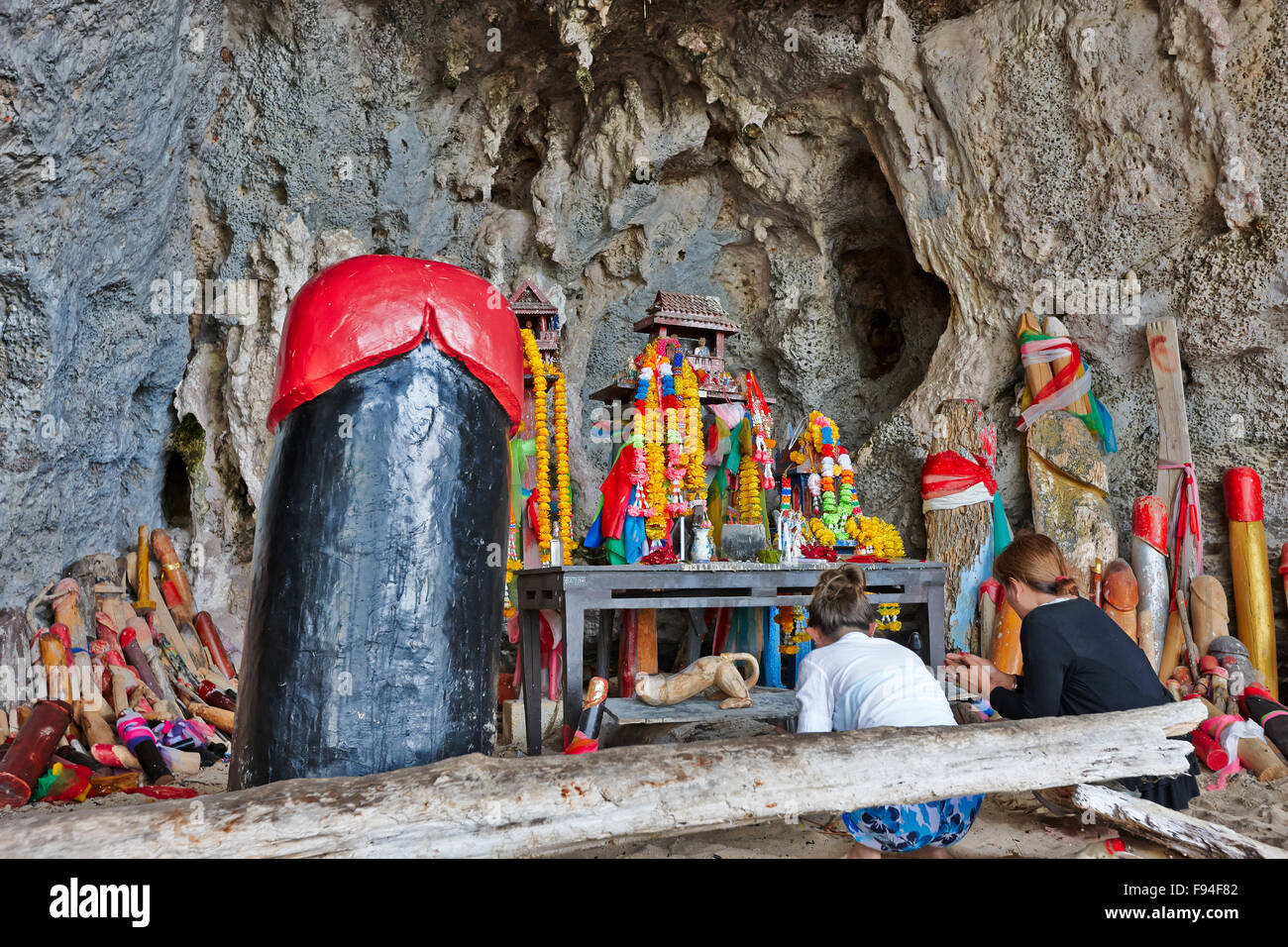 Women pray in Phra Nang Cave Shrine dedicated to princess goddess named ...