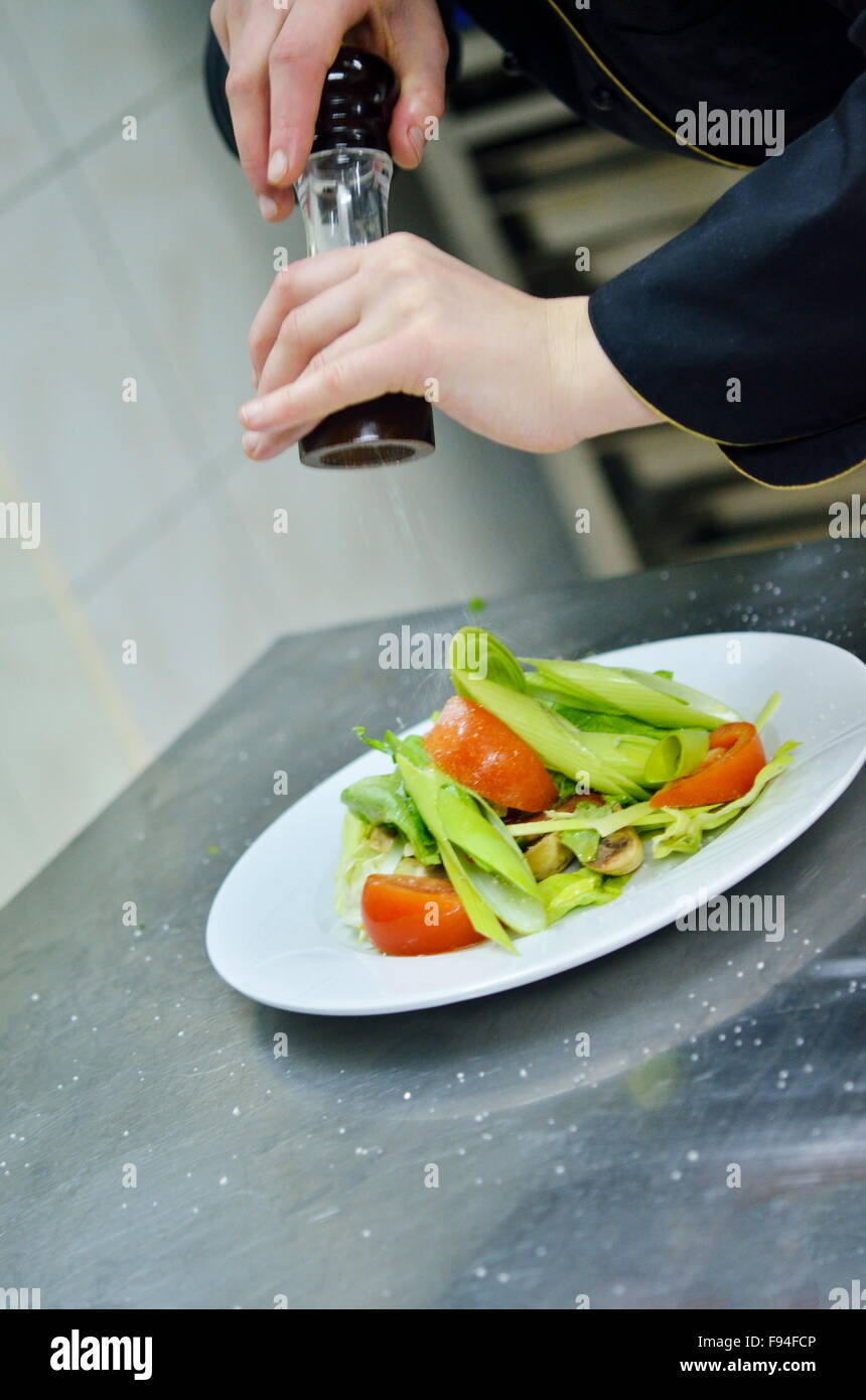 beautiful young chef woman prepare and decorating tasty food in kitchen ...