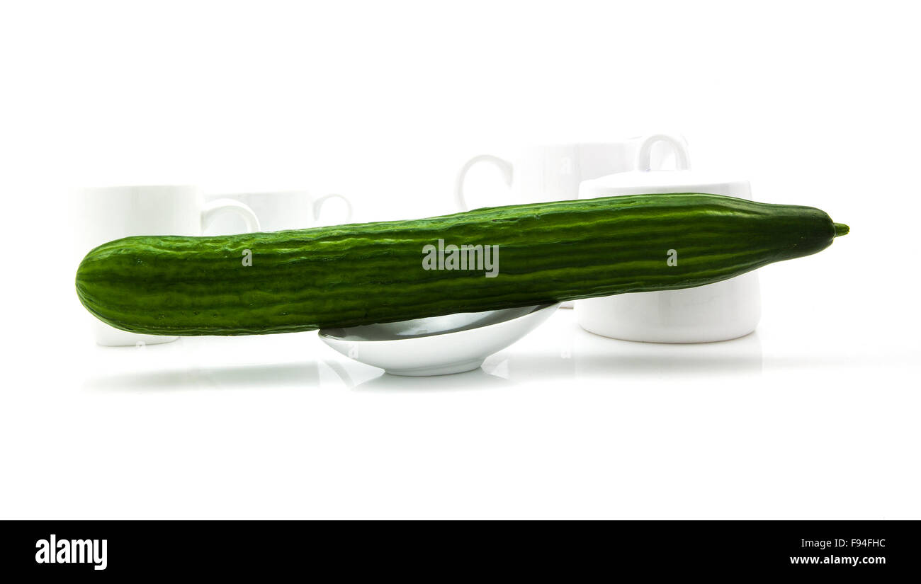 Single fresh home grown cucumber in modern white kitchen setting Stock ...