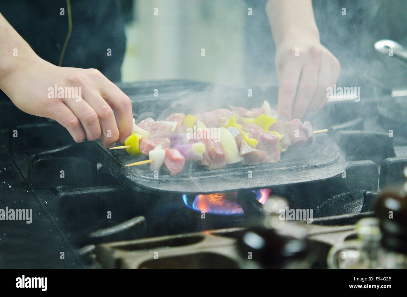 beautiful young chef woman prepare and decorating tasty food in kitchen ...